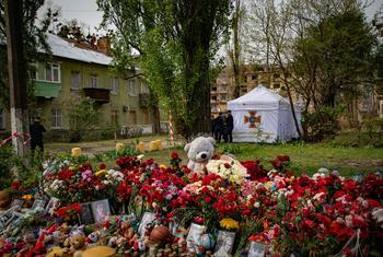 Toys and flowers are laid in memory of those killed in an attack in Kyiv, Ukraine.