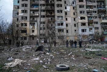 Residents assess the damage to buildings in Kupiansk, in the Kharkiv region of Ukraine. (file photo)